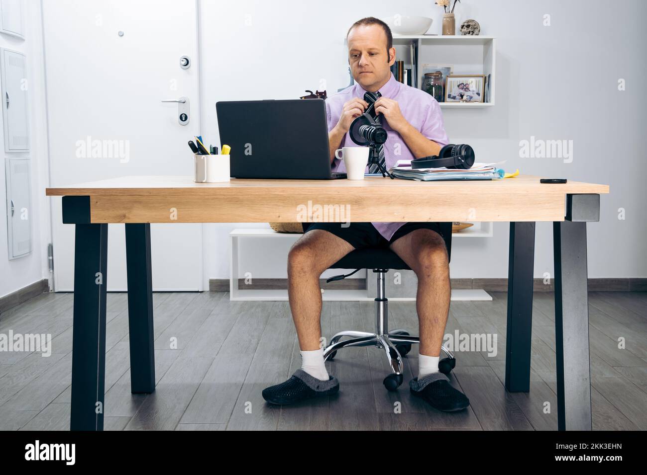 Telecommuting and slippers hi-res stock photography and images - Alamy