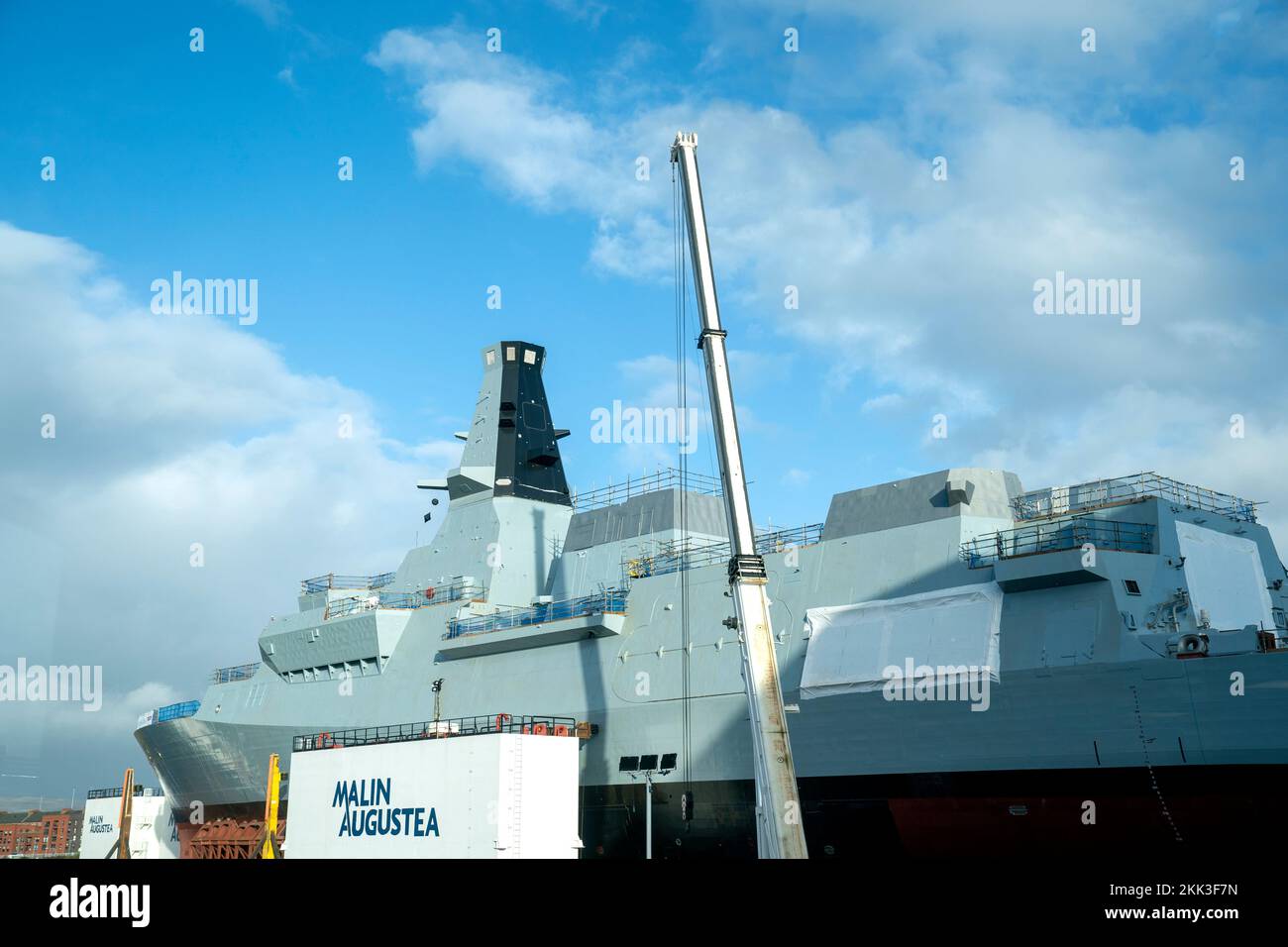 HMS Glasgow is manoeuvred onto a barge at the BAE Govan shipyard in ...