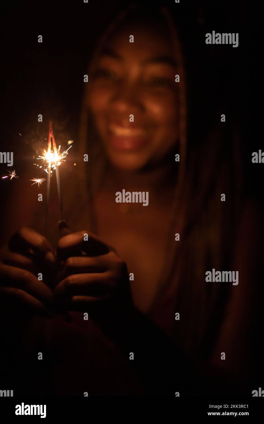 An Attractive Dark Skinned Girl Holds Burning Cold Fires In Her Hand