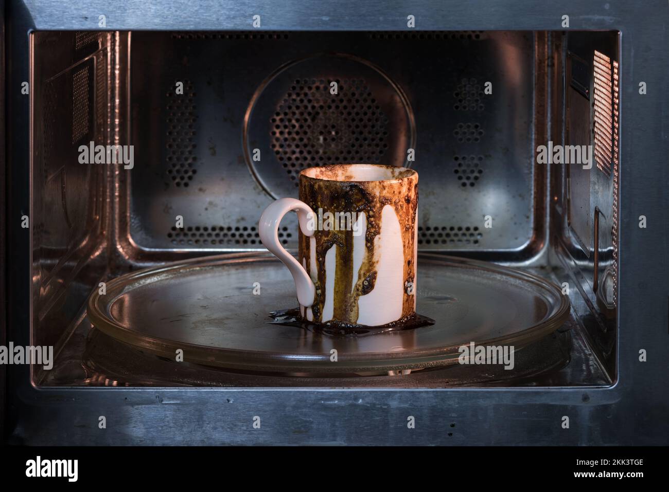 Spilt overflowed coffee drink in microwave causing serious mess to ...