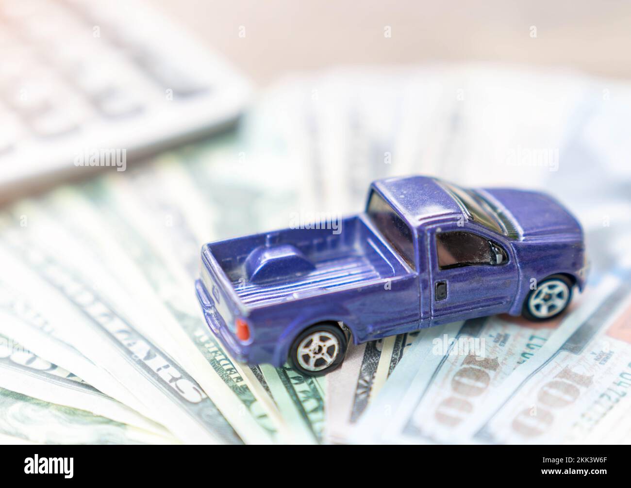 Car model on dollar bills hi-res stock photography and images - Alamy