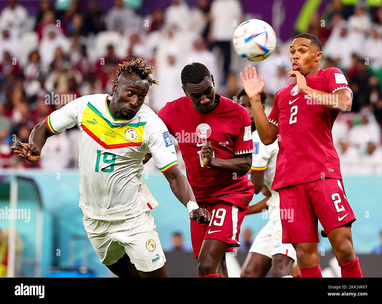 Doha, Qatar. 25th Nov, 2022. Famara Diedhiou (1st L) of Senegal scores ...