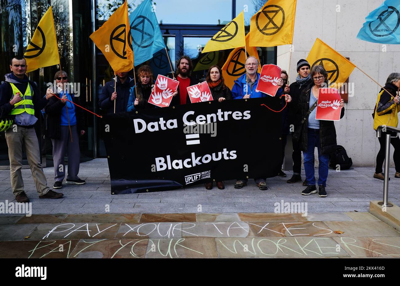 People attend a protest outside Amazon's European Headquarters in ...
