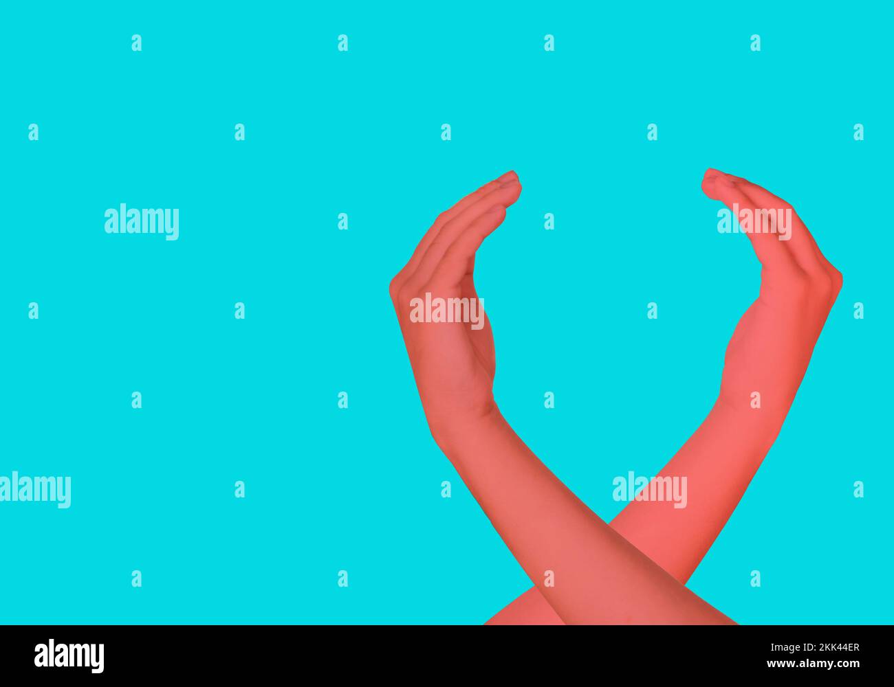 The red arms crossed in a heart shape on aqua blue background against ...
