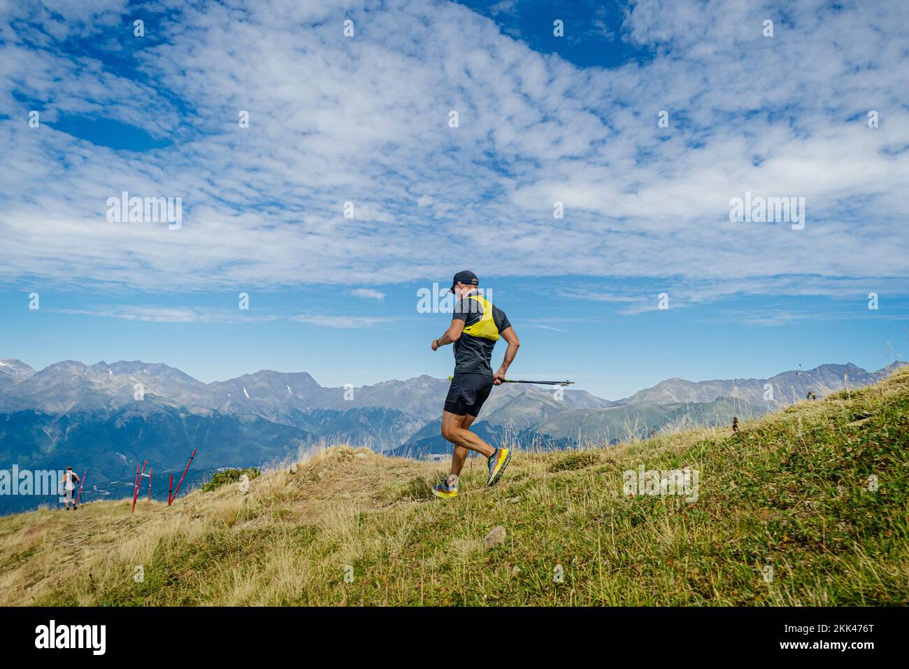 male runner running mountain trail race Stock Photo - Alamy