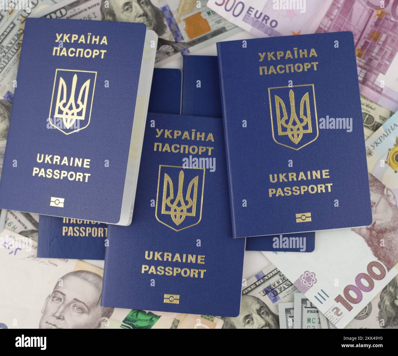 Foreign passports of Ukrainians. Money on the background. Blue visa ...