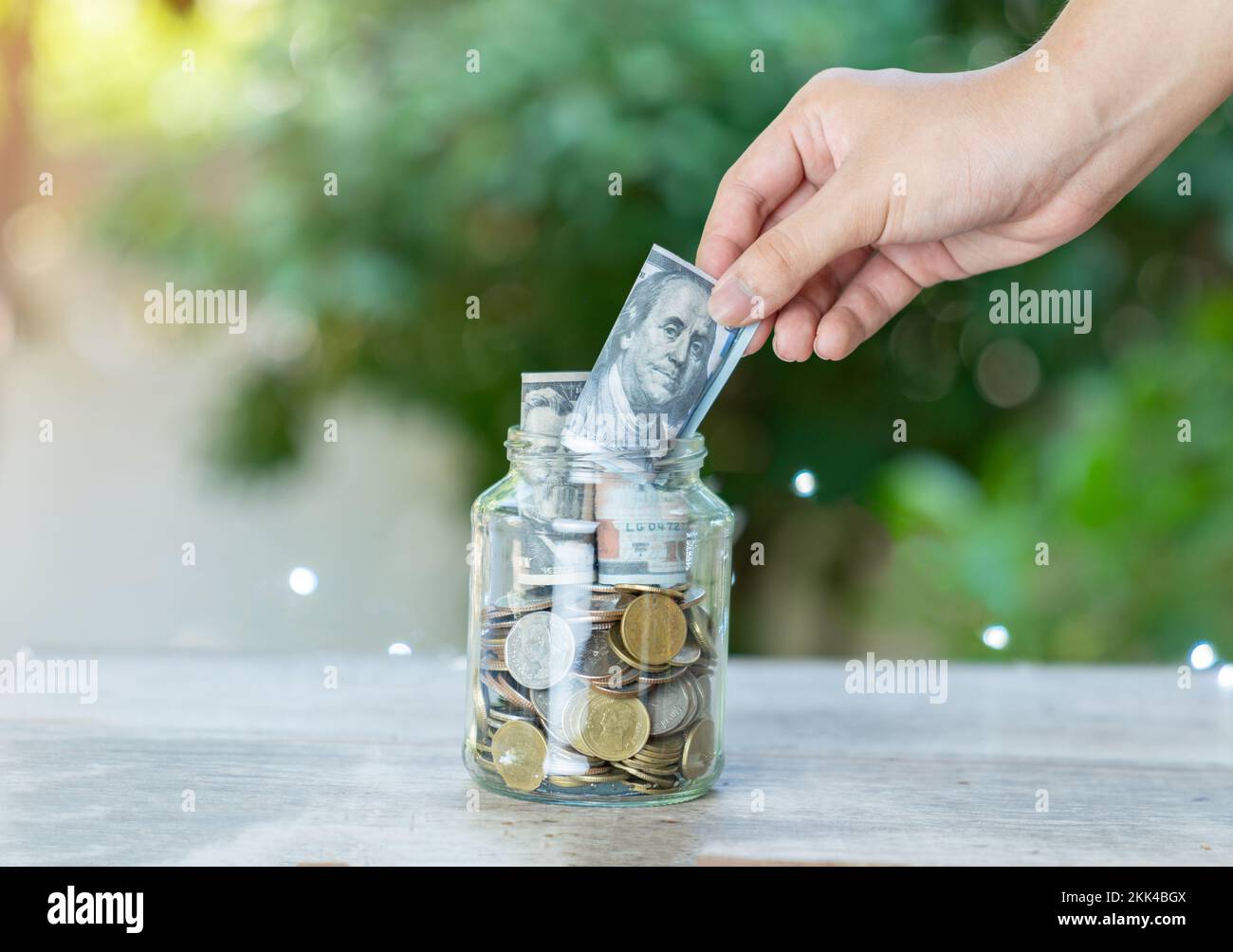 Money jar filling up hi-res stock photography and images - Alamy