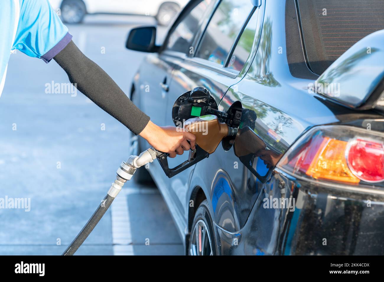 Man Refill and filling Oil Gas Fuel at station.Gas before go to work ...