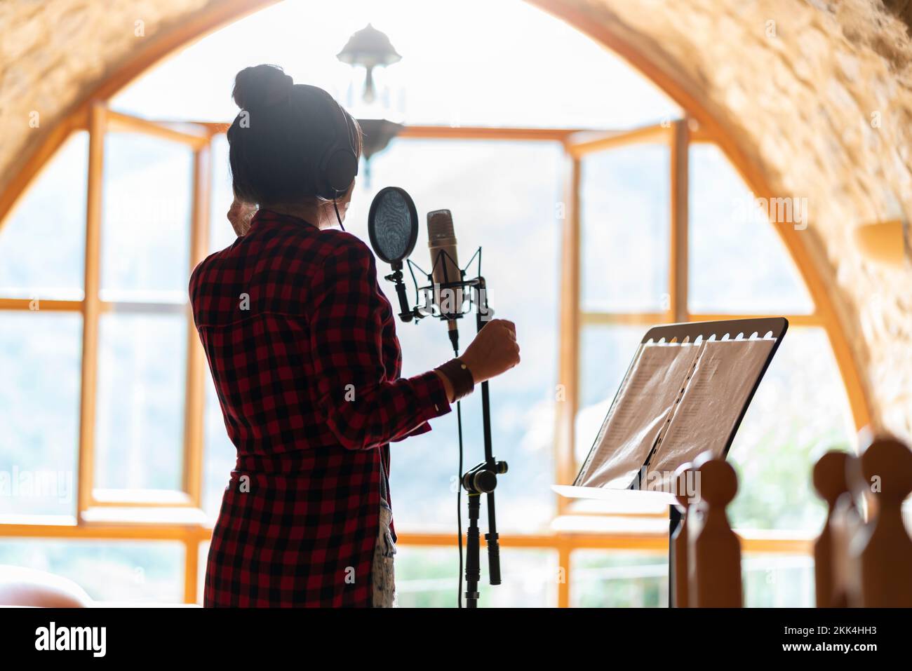 Professional singer woman recording a song in a studio Stock Photo - Alamy