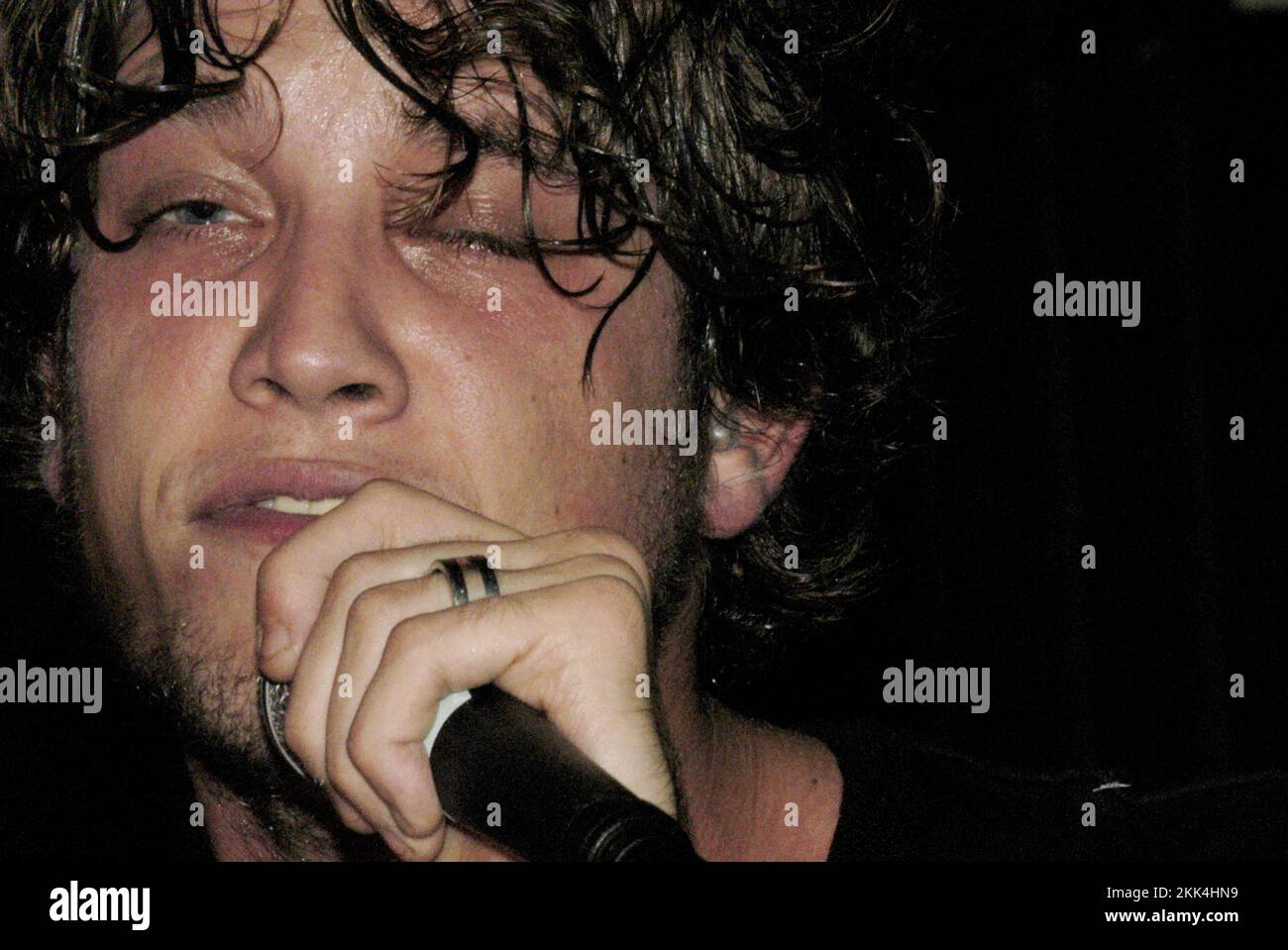 Singer Nick Atkinson from the pop band ROOSTER playing a sweaty early ...