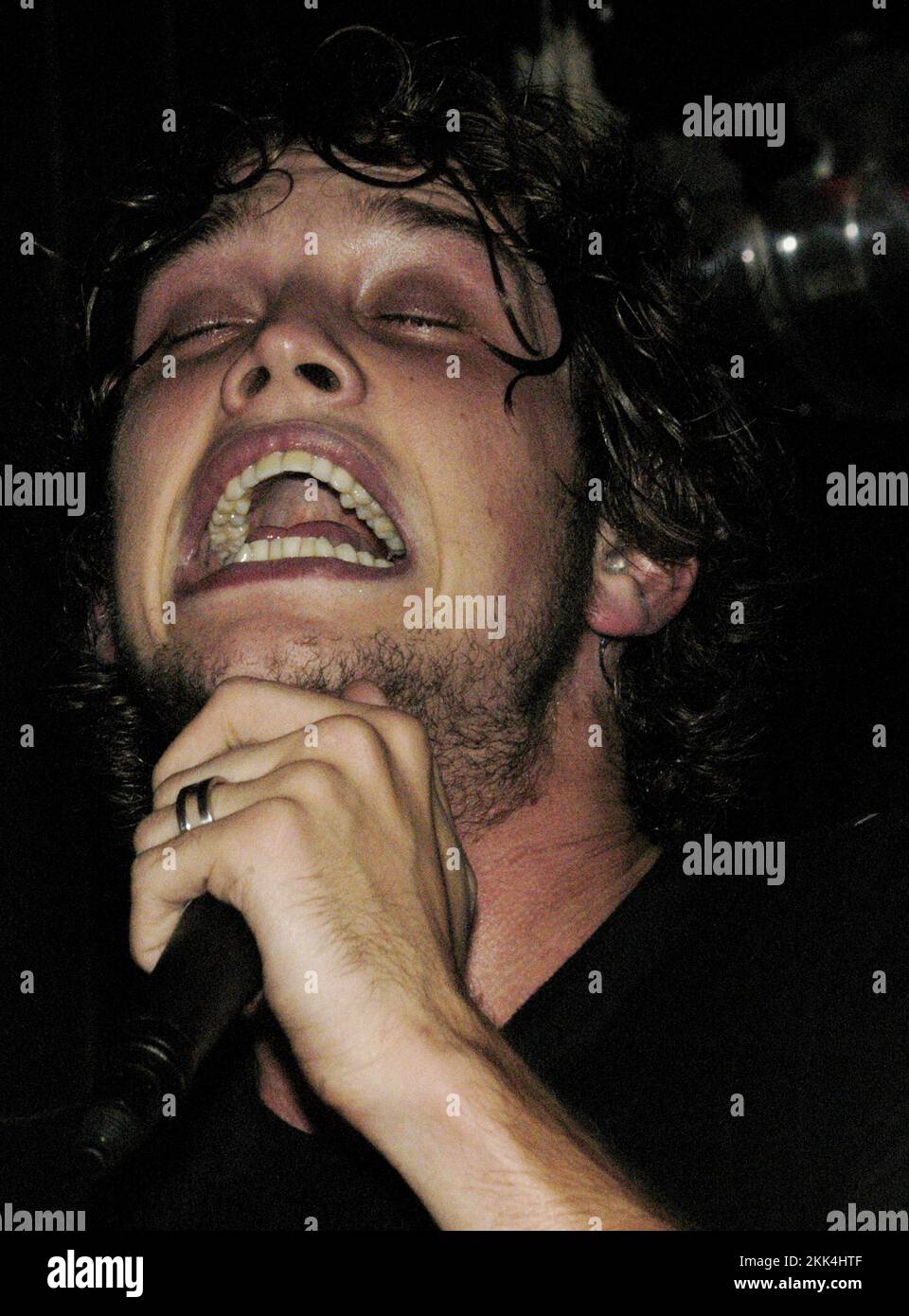 Singer Nick Atkinson from the pop band ROOSTER playing a sweaty early ...