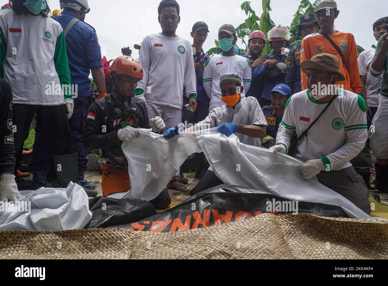 Cianjur, West Java, Indonesia. 25th Nov, 2022. People prepare a burial ...