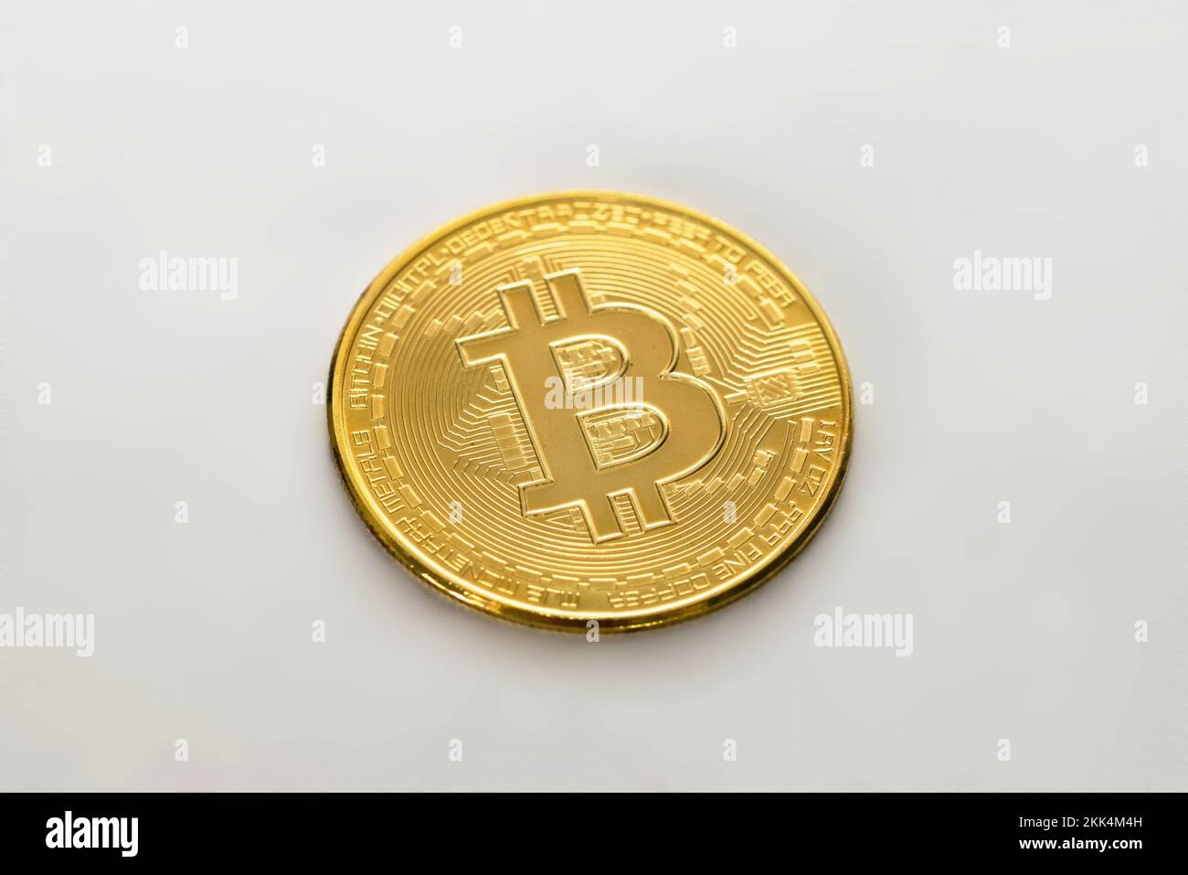 Golden physical Bitcoin on white background. Digital currency ...