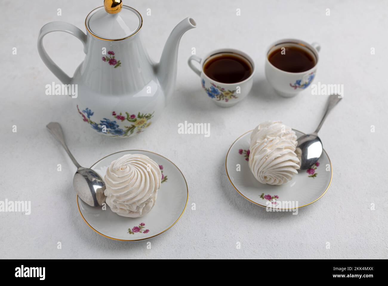 tea party with delicate airy zephyr on a light background. homemade ...