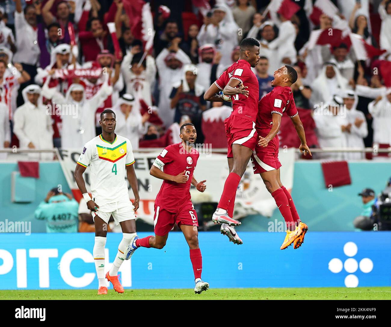 Doha, Qatar. 25th Nov, 2022. Mohammed Muntari (2nd R) of Qatar ...