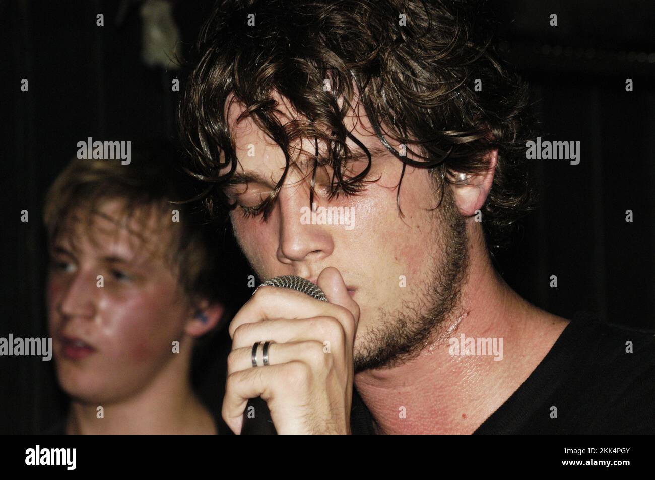 Singer Nick Atkinson from the pop band ROOSTER playing a sweaty early ...