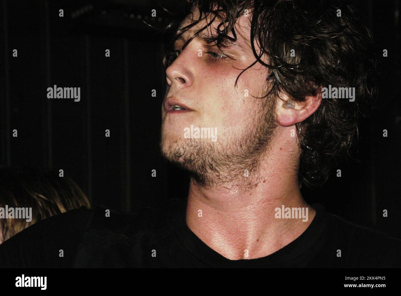 Singer Nick Atkinson from the pop band ROOSTER playing a sweaty early ...