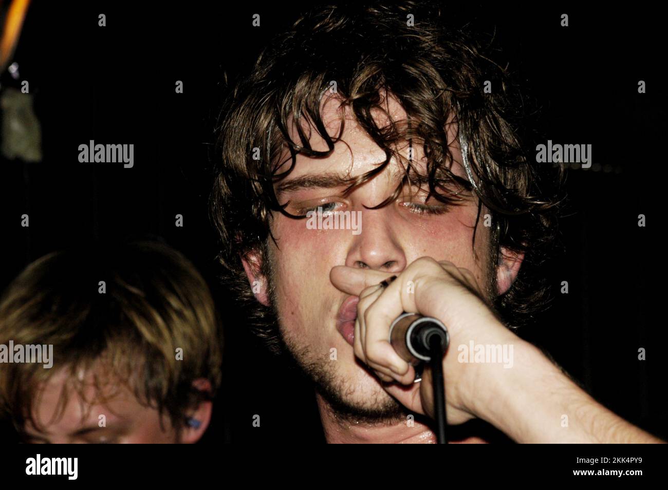 Singer Nick Atkinson from the pop band ROOSTER playing a sweaty early ...