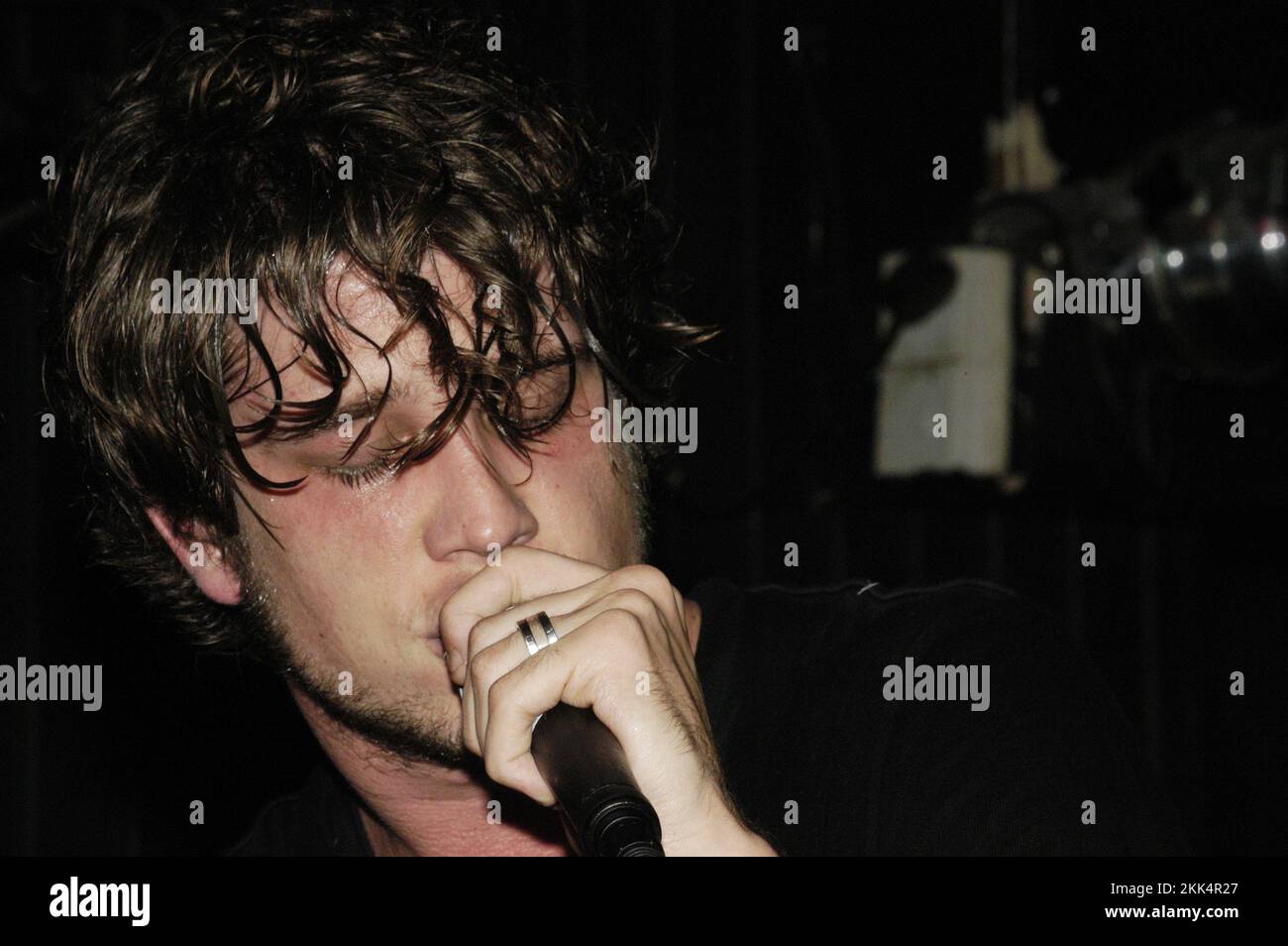Singer Nick Atkinson from the pop band ROOSTER playing a sweaty early ...