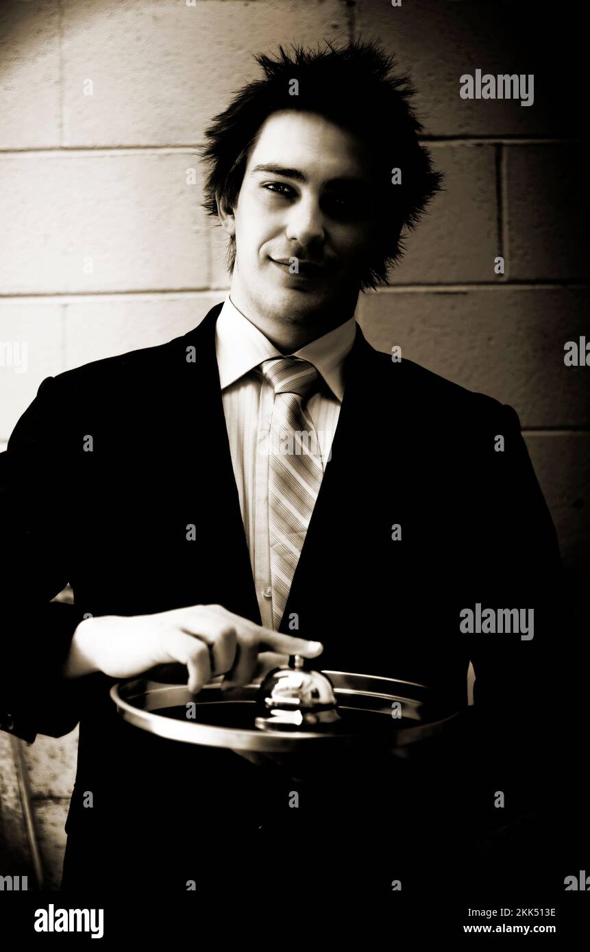 Vintage Male Concierge Or Business Man Pressing The Button On A Hotel ...