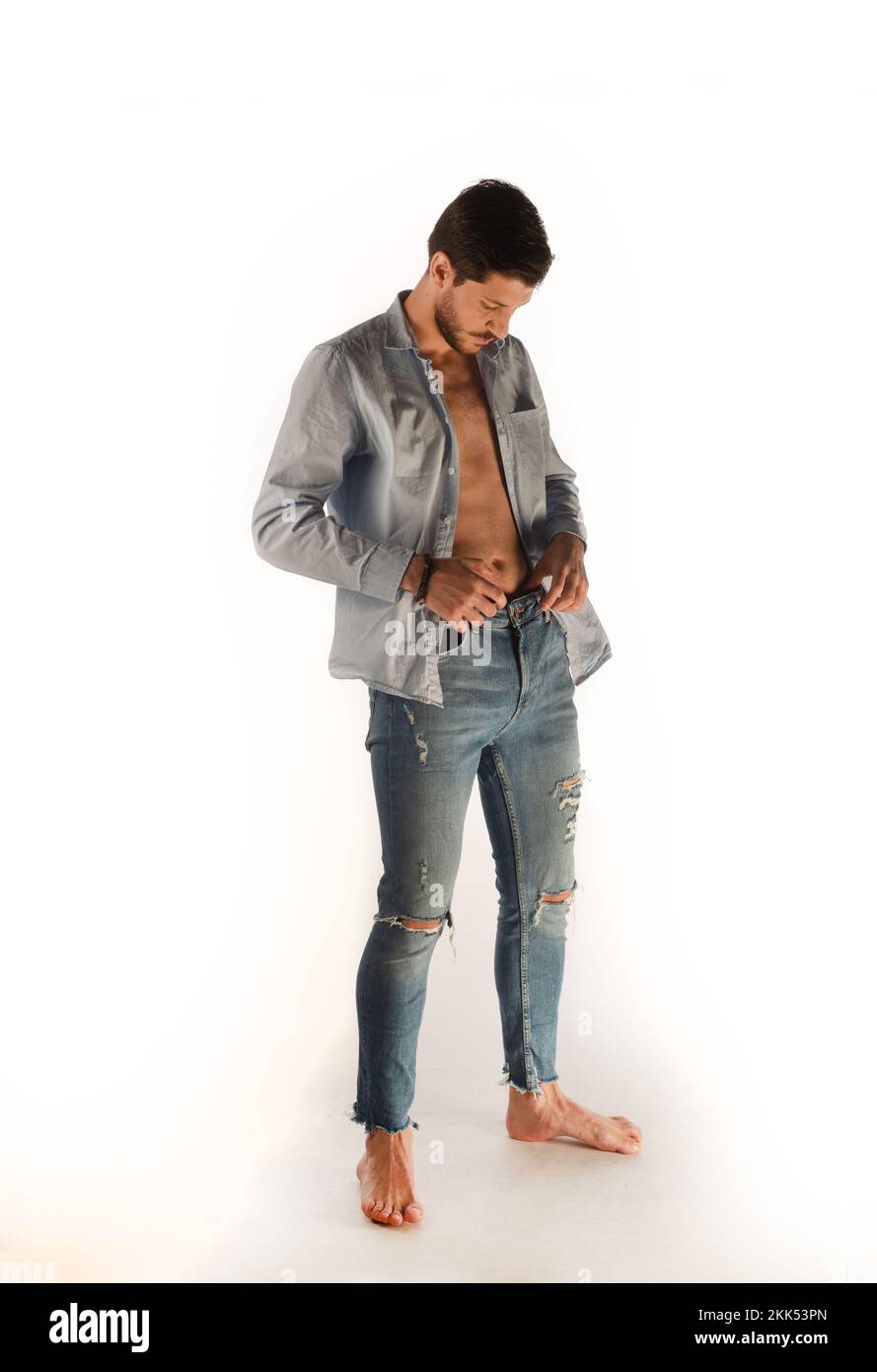 Adult fashion model doing seductive poses in the studio Stock Photo - Alamy