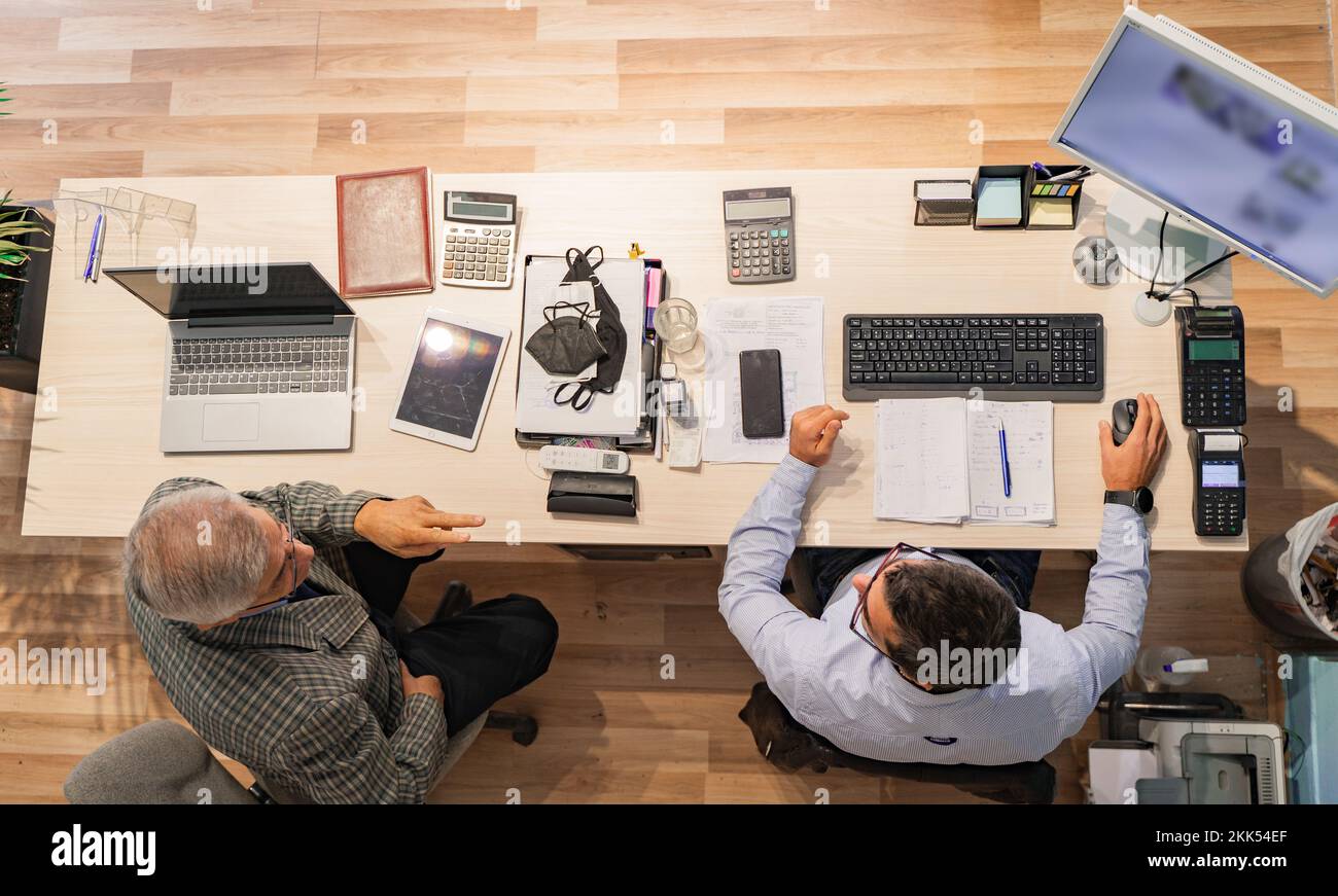Two senior businessmen are having a conversation, high angel Stock ...