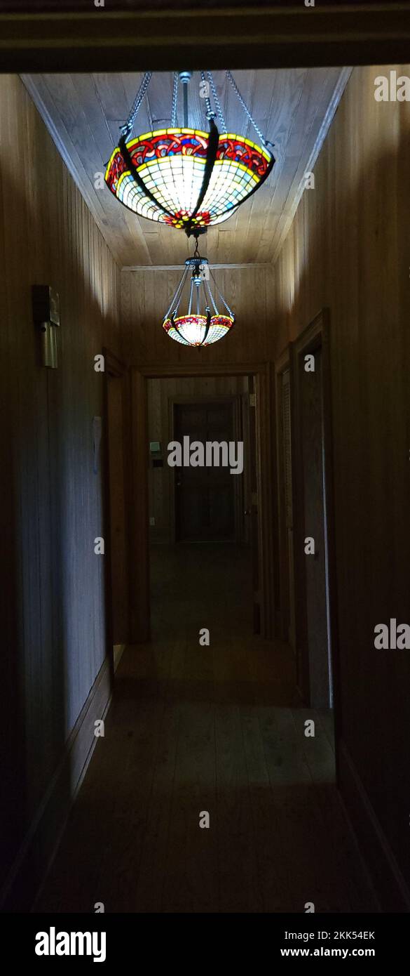 A vertical shot of a house corridor with a vintage colorful light ...
