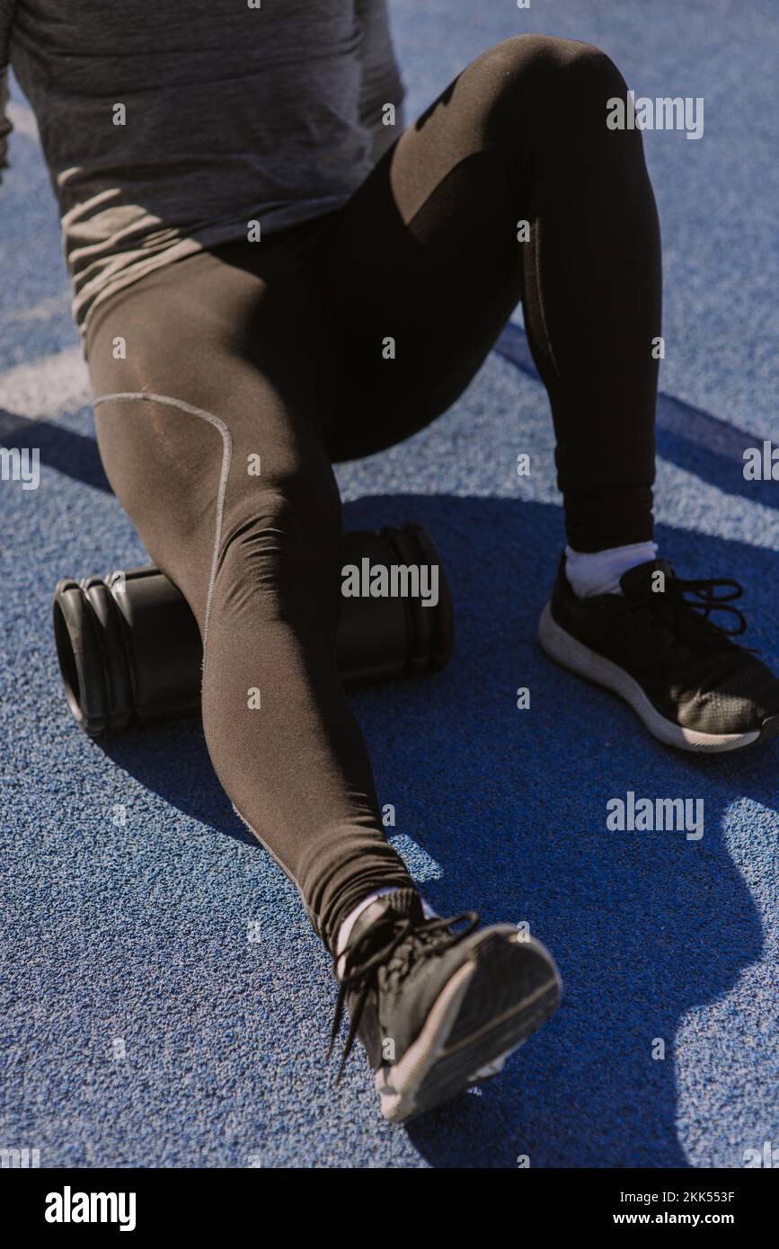 Sportspeople stretching legs hi-res stock photography and images - Alamy