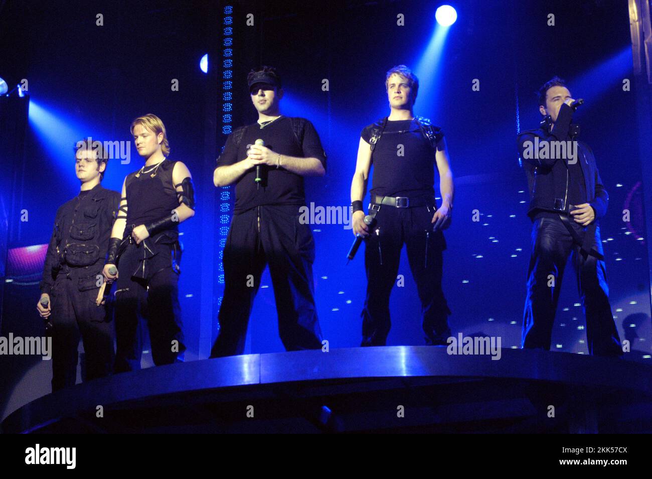WESTLIFE, PEAK FAME, CONCERT, 2003: A full band image of the Irish ...