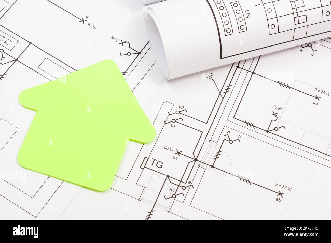 House shape made of paper and electrical construction housing plan ...