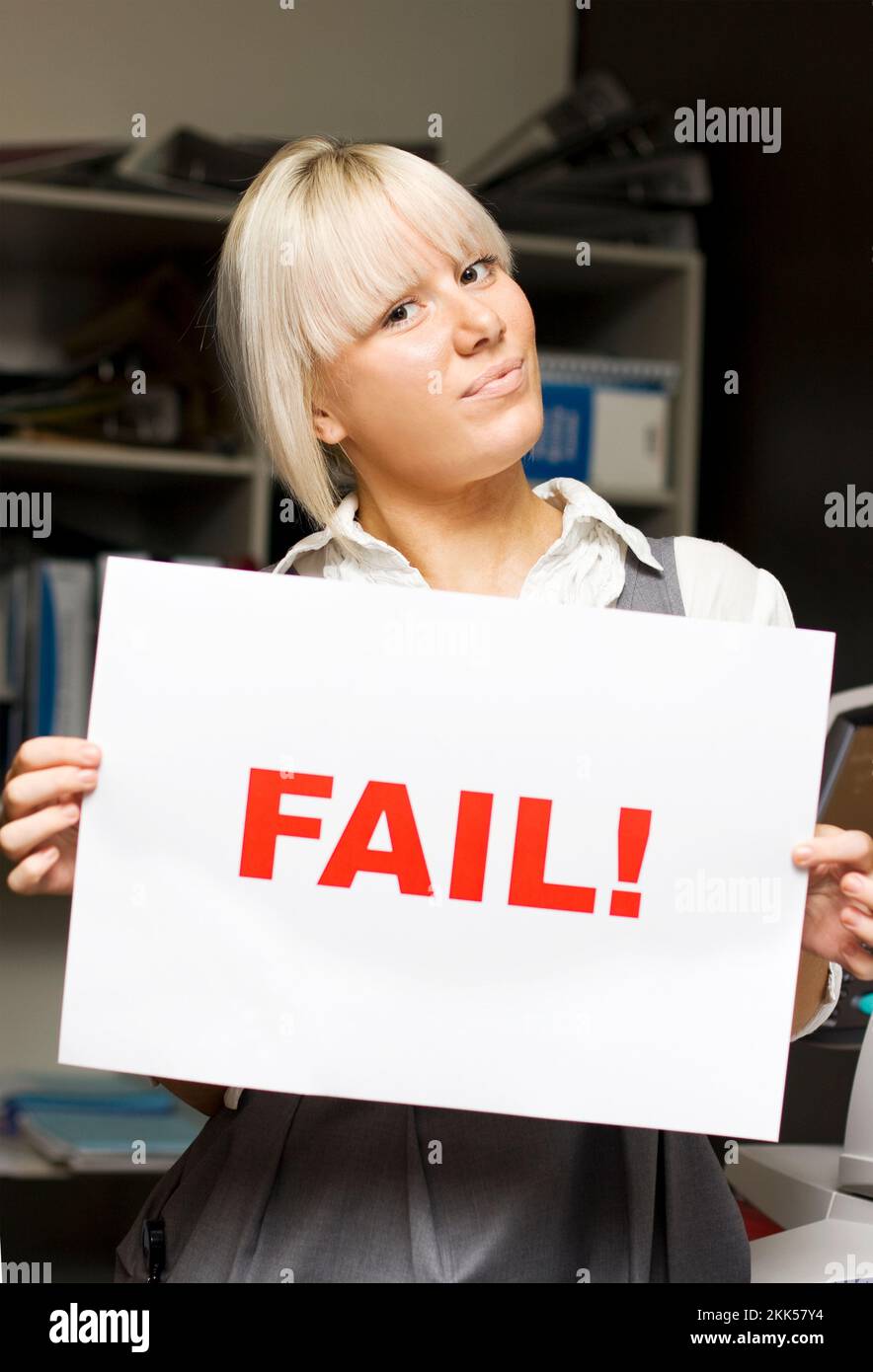 Fail To You Says The Sign An Corporate Woman Holds Up In An Office ...