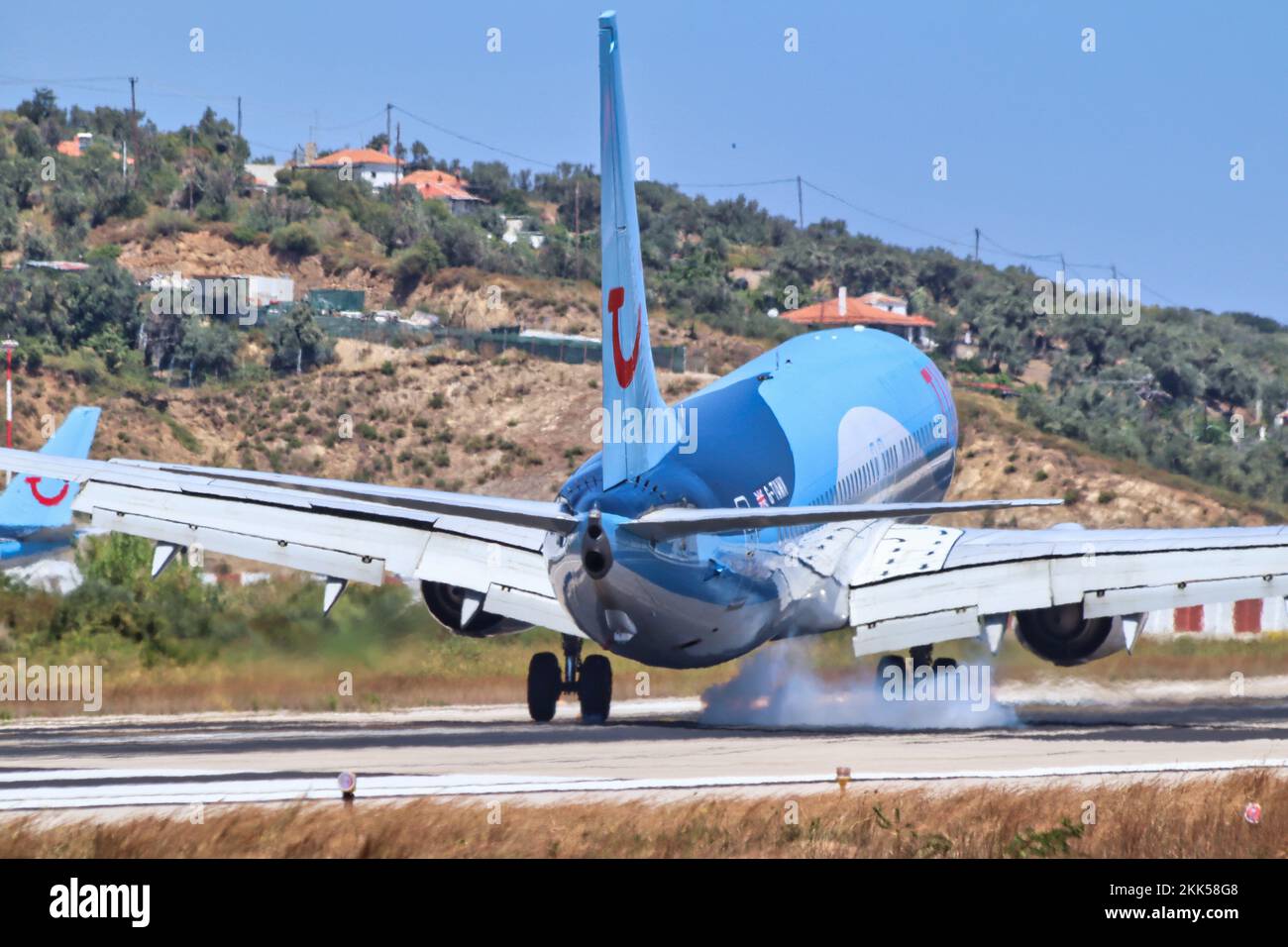 The TUI fly B737 landing hard at Skiathos airport on a sunny day Stock ...