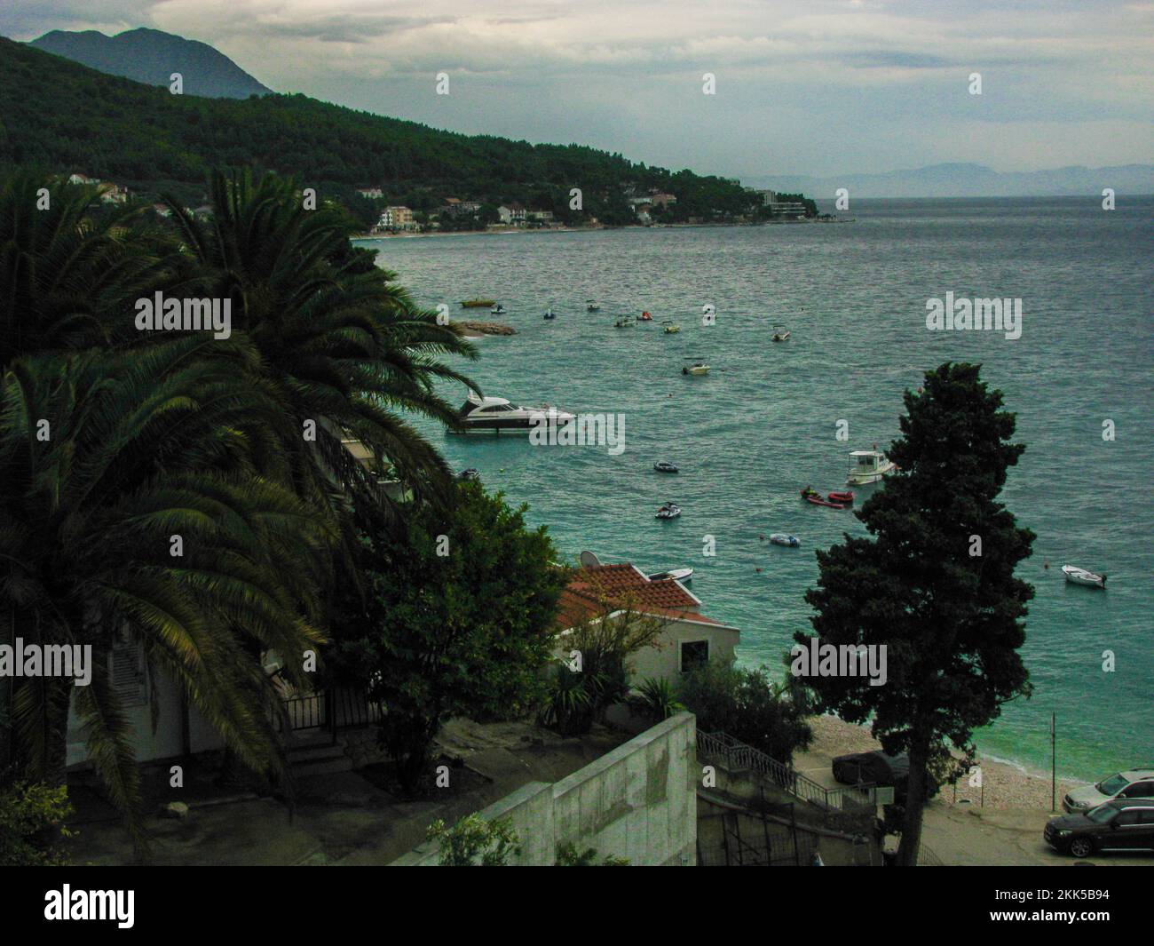 A scenic natural view of sea with a floating boats Stock Photo - Alamy