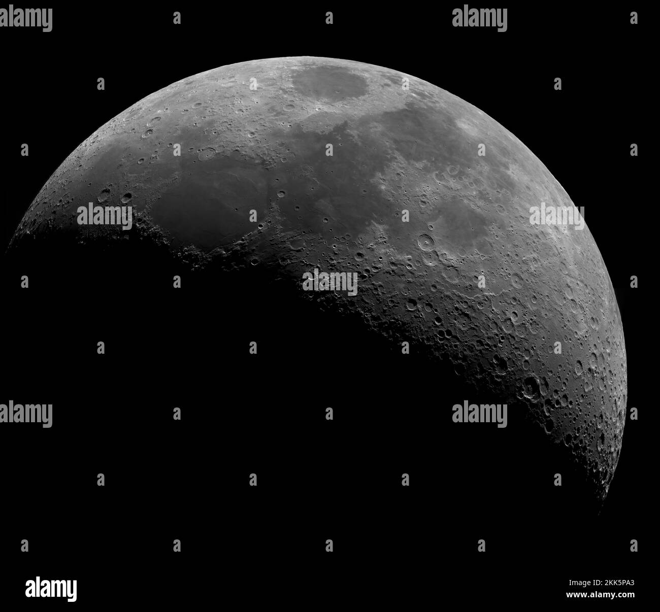 A scenic zoomed-in shot of the moon in the night sky Stock Photo - Alamy