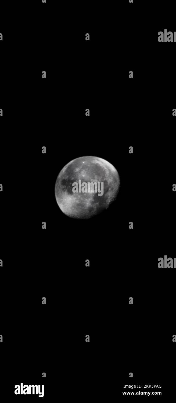 A scenic zoomed-in shot of the moon in the night sky Stock Photo - Alamy