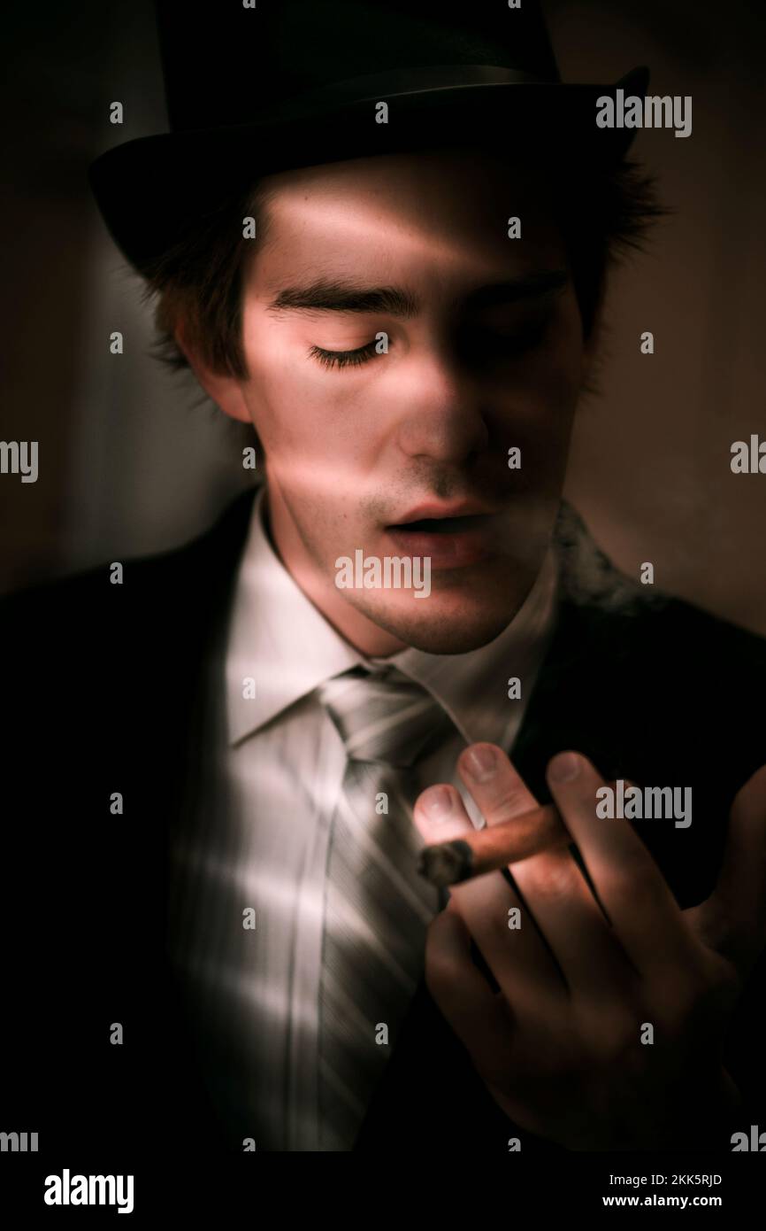Man smoking in shadows hi-res stock photography and images - Alamy