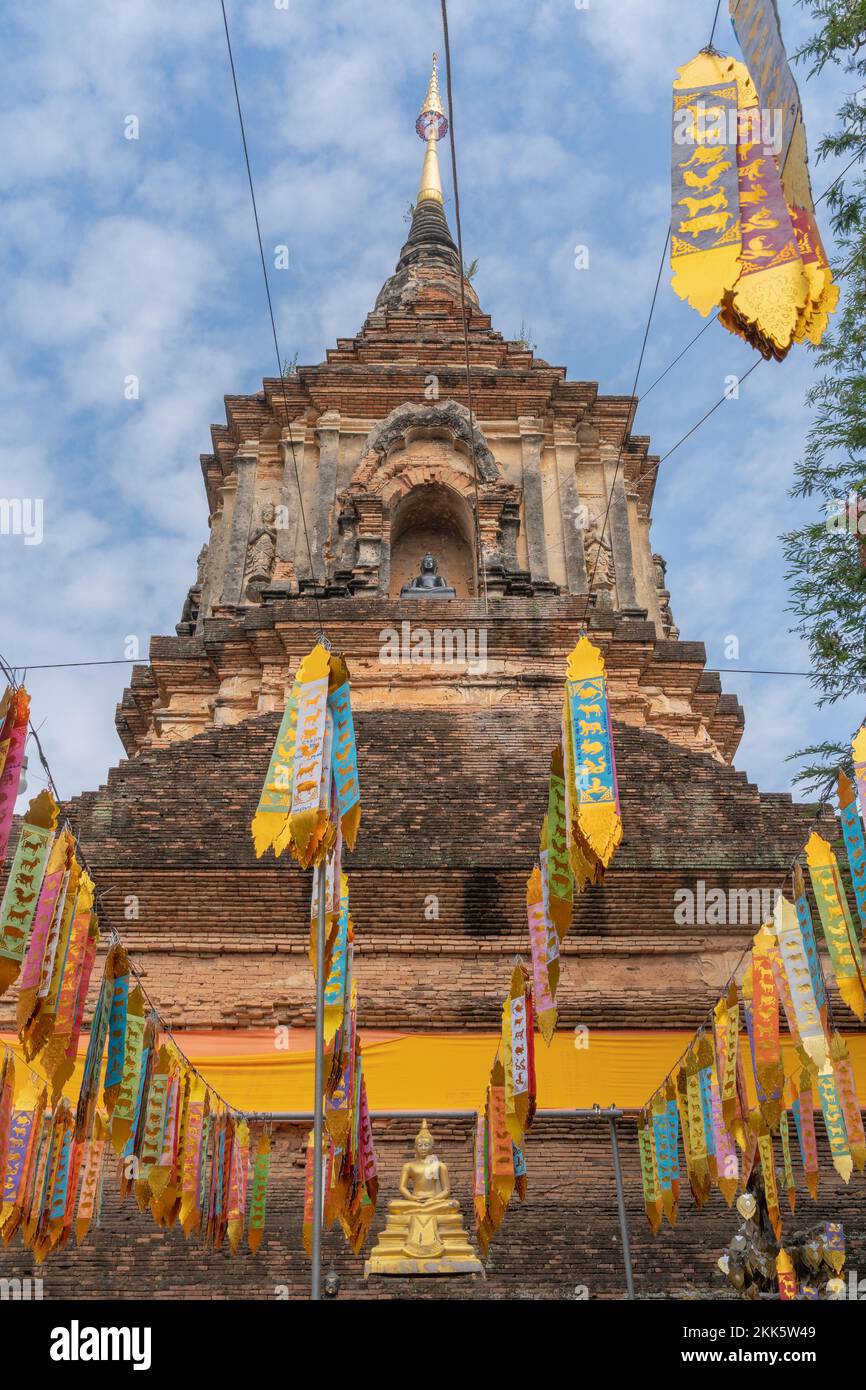 Landscape view of ancient brick and stucco stupa or chedi with colorful ...