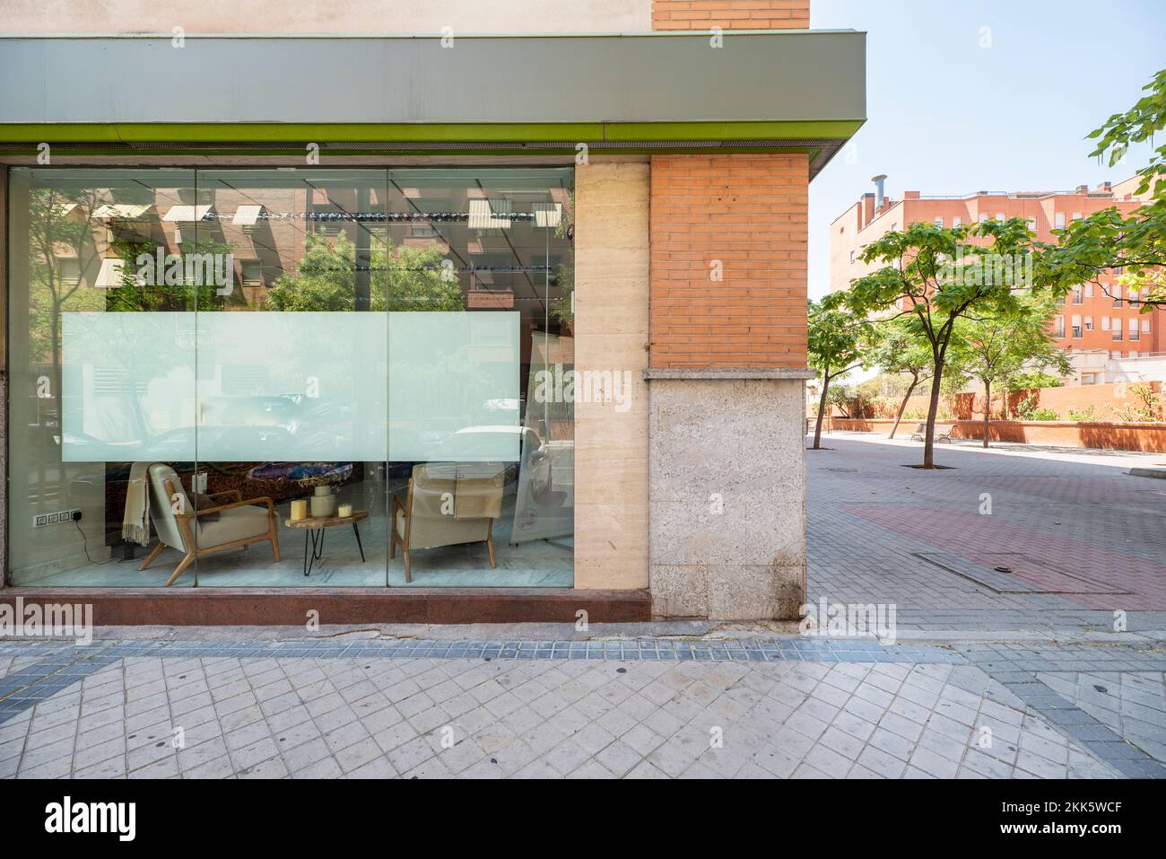 Facade of an urban residential housing building with a commercial ...