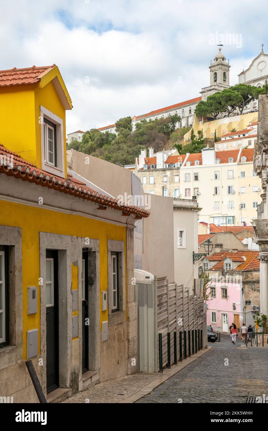 A street with vintage buildings on the slopes of a hill in the historic ...