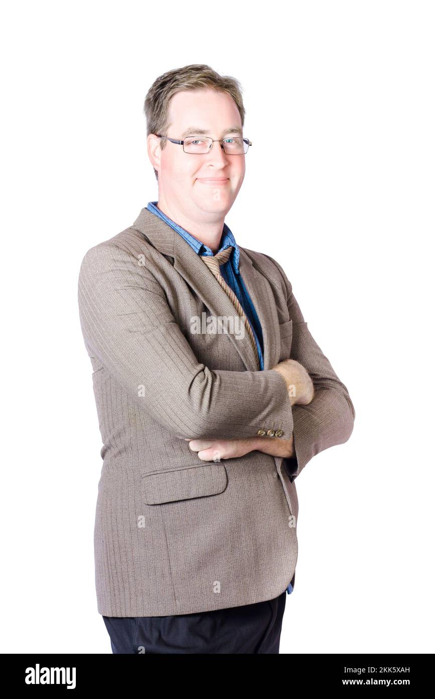Isolated portrait of a smiling confident businessman with arms resting ...