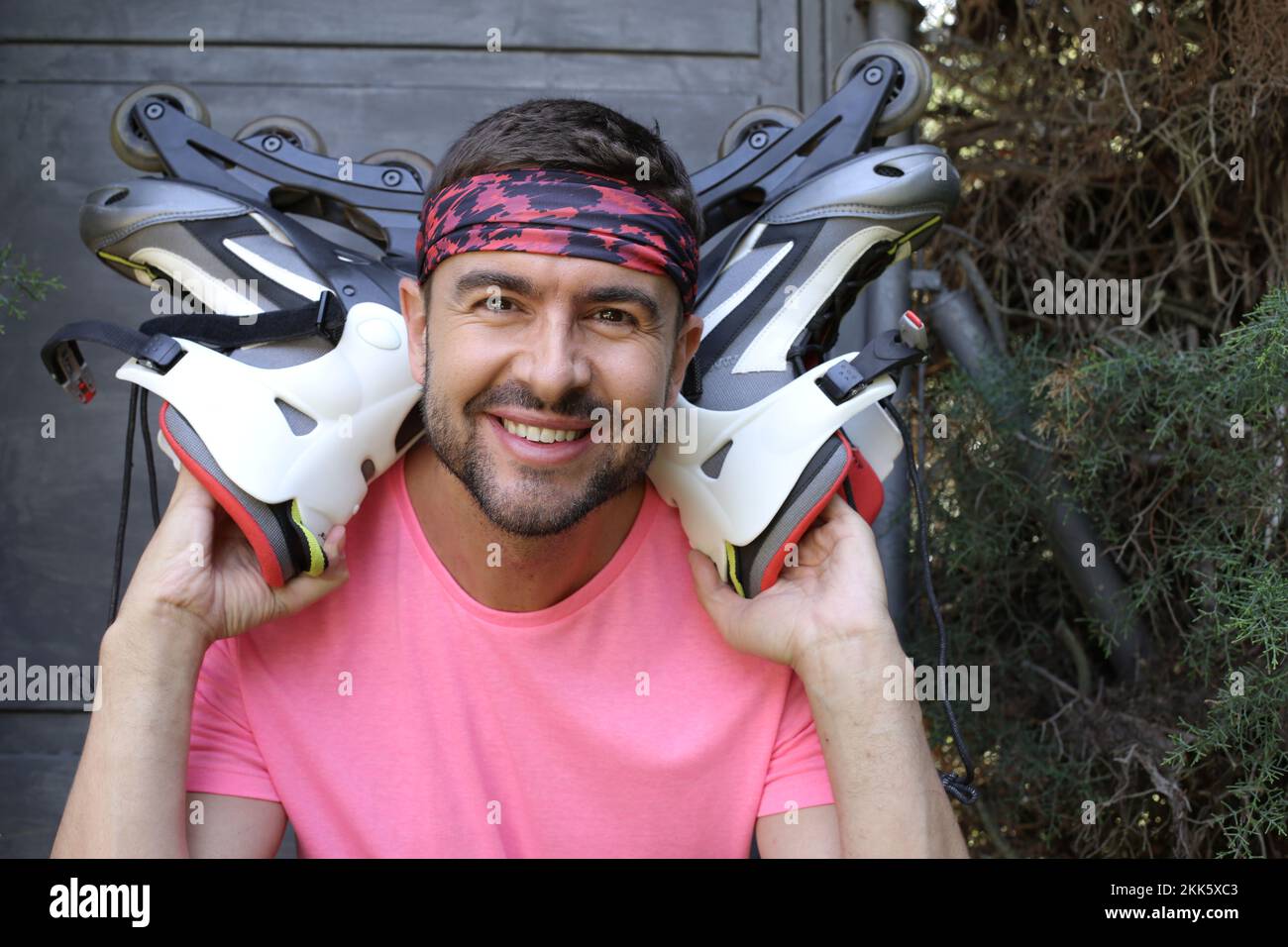 Young roller skater holding hi-res stock photography and images - Alamy