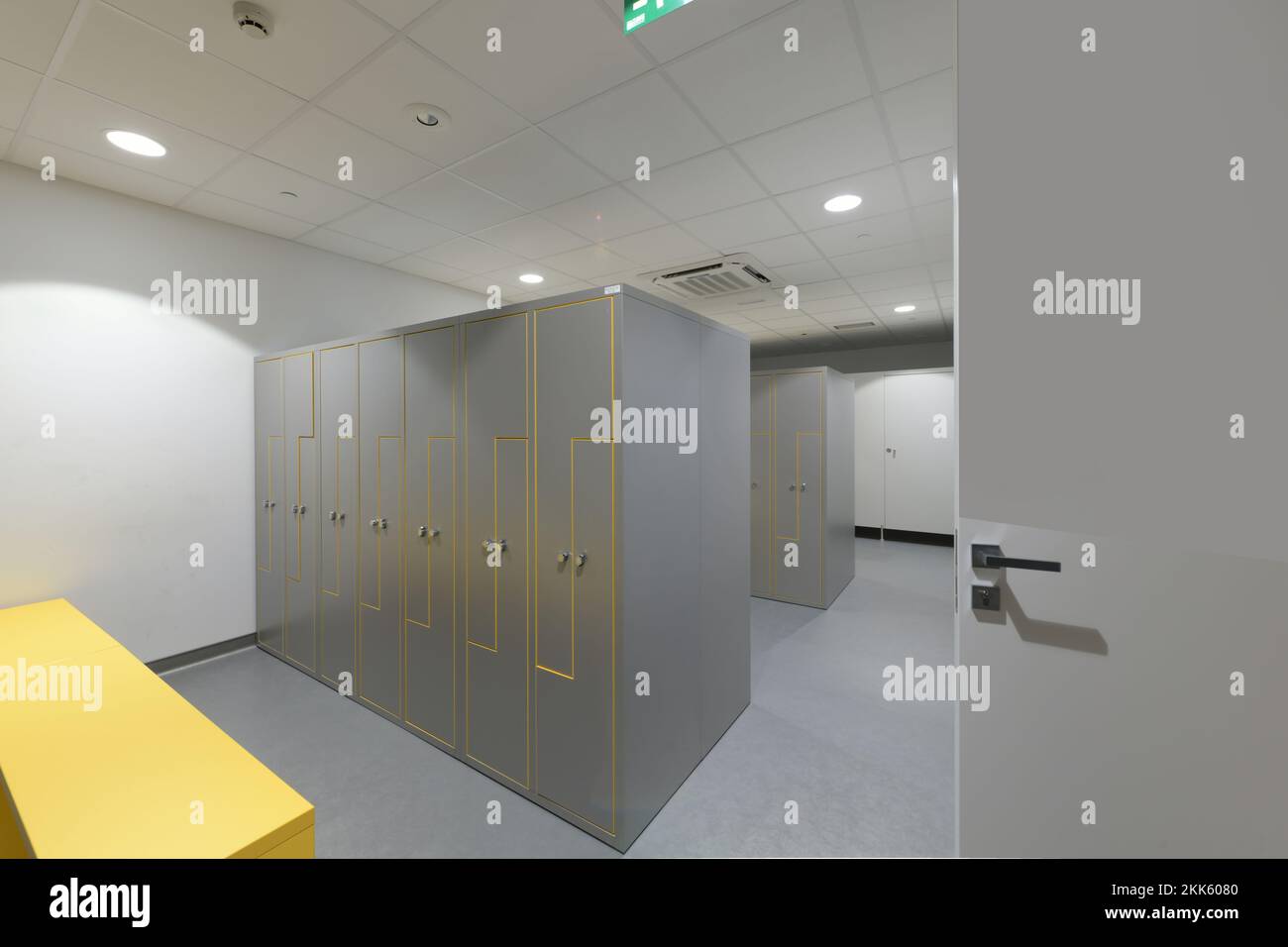 Large gray lockers with subdivisions that apply as lockers and yellow ...