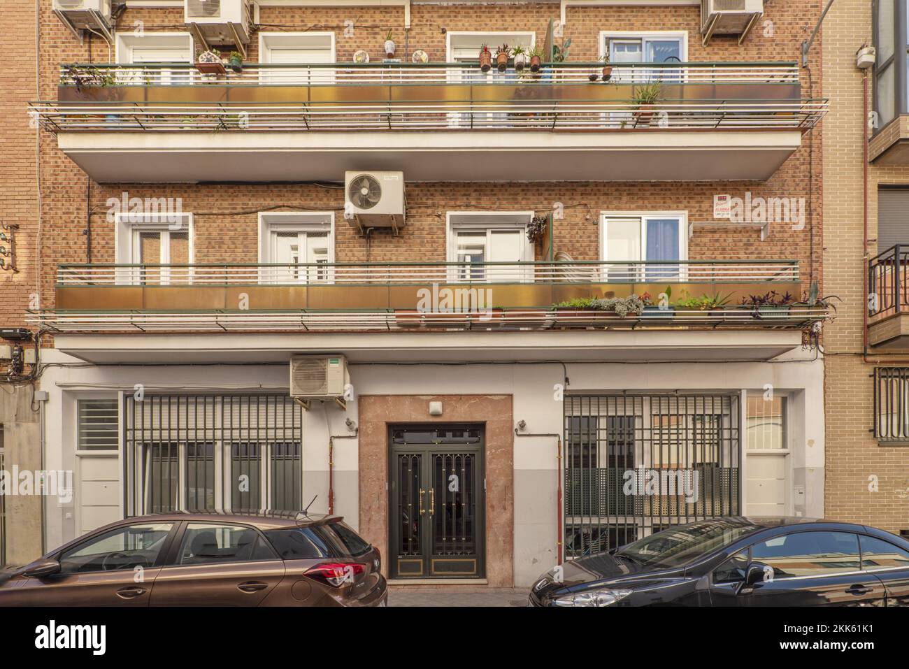 Facade of a small urban residential apartment building with elongated ...