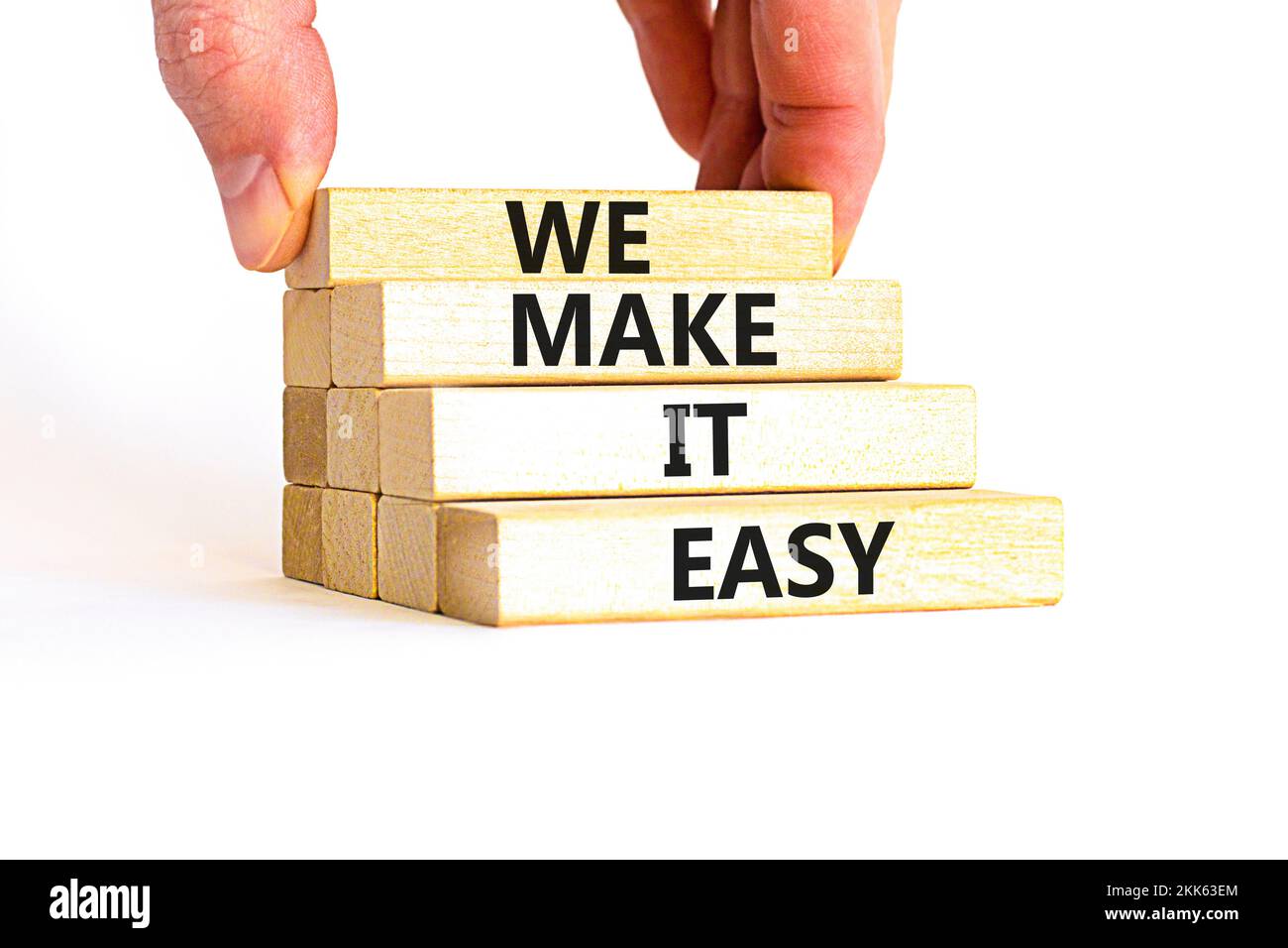 We make it easy symbol. Concept words We make it easy on wooden cubes ...