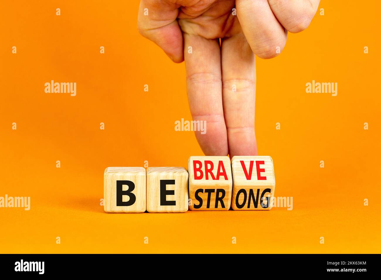Be strong and brave symbol. Concept word Be strong Be brave on wooden ...