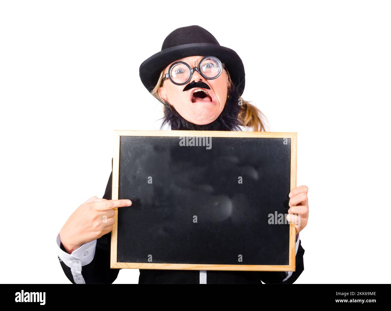 Odd female teacher with a bewildered look holding a blank blackboard ...
