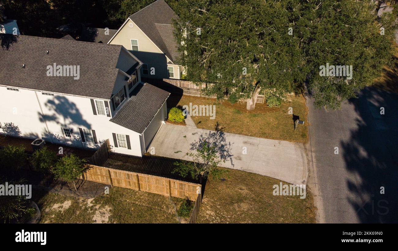 A high angle view of modern houses in the forest on a sunny day Stock ...