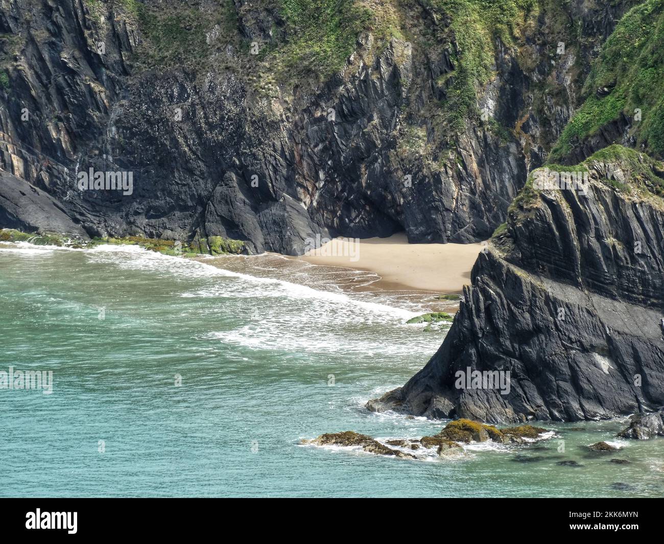 The view of water waves touching the cliffs at the Cornwall beach Stock ...
