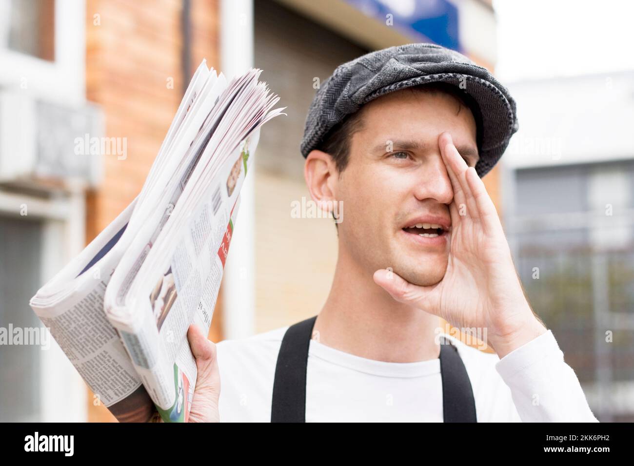 Calling For Buyers A Spruiker News Paper Boy Yells Out Loudly Extra ...