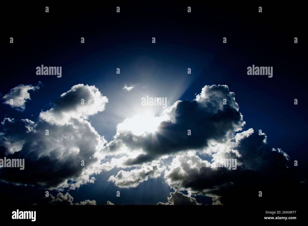 Sky Landscape Of The Sun Emerging From An Ethereal And Heavenly Cloud Formation Stock Photo - Alamy